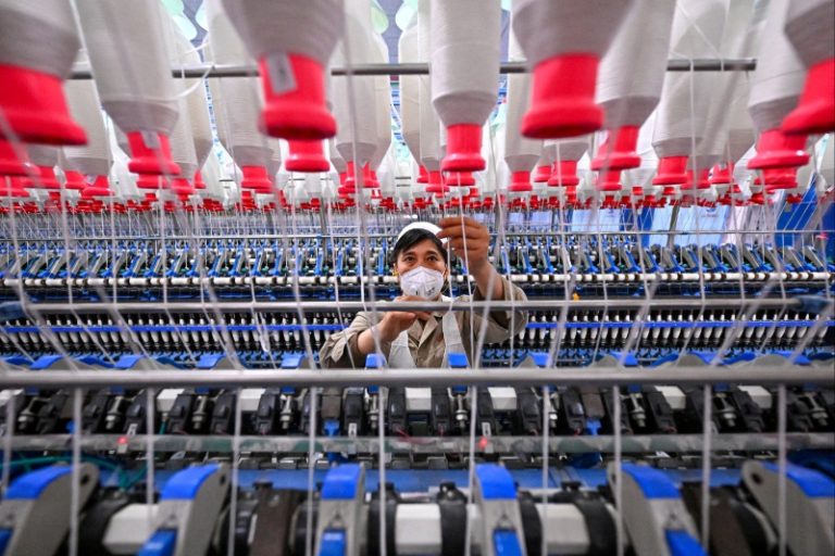 In China, whispers of change as some companies tell staff to work less