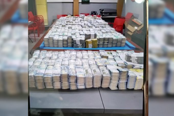 'Pure evil': Outrage flares as photos show alleged kickbacks in flood ...